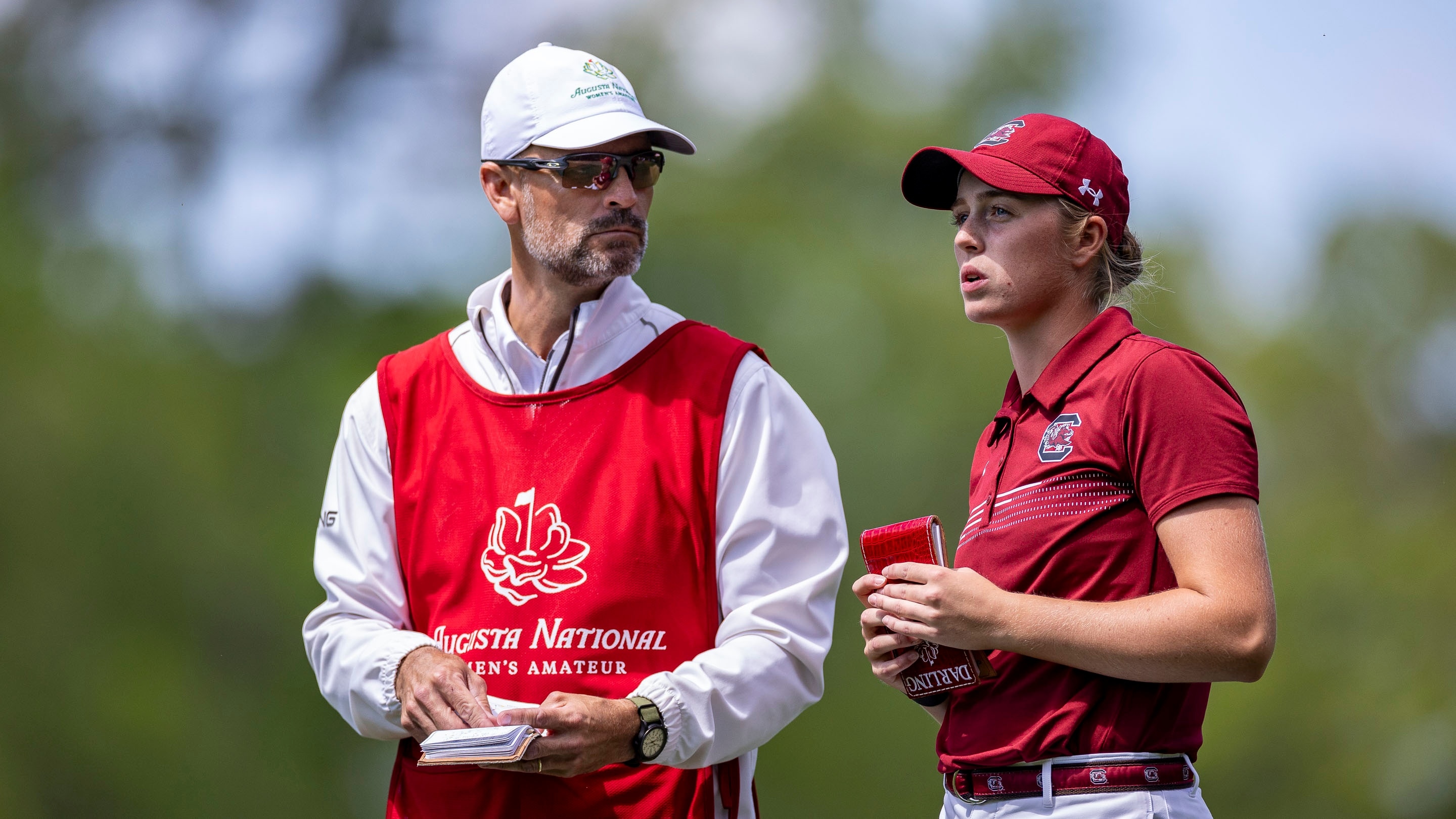 Hannah Darling of Scotland speaks with her caddie Jonathan Burnett on ...