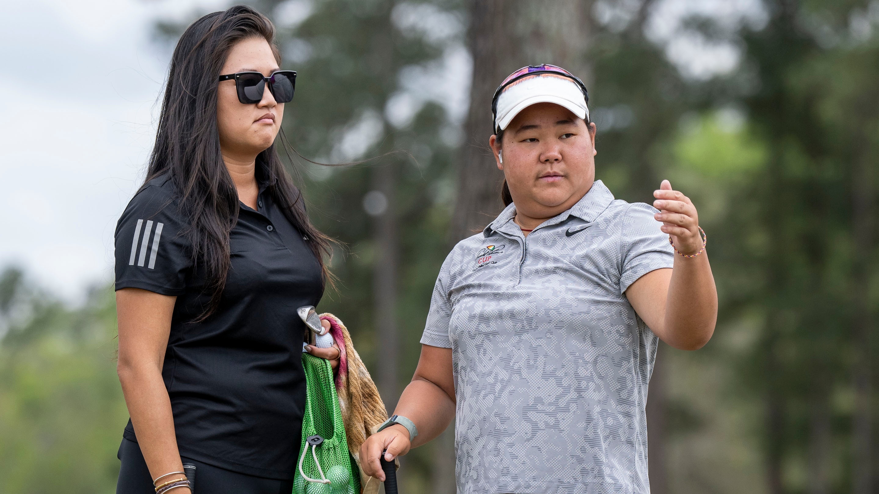 Mirabel Ting of Malaysia on the practice range with Malaysian ...